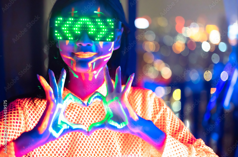 Neon asian woman dancing. Fashion model woman in neon light, portrait ...