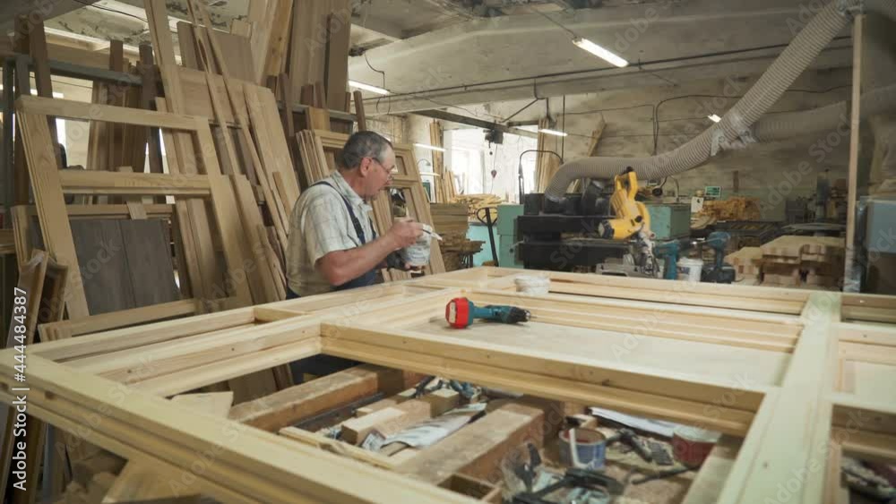 A Master Carpenter is dealing with the assembly of the wooden product ...