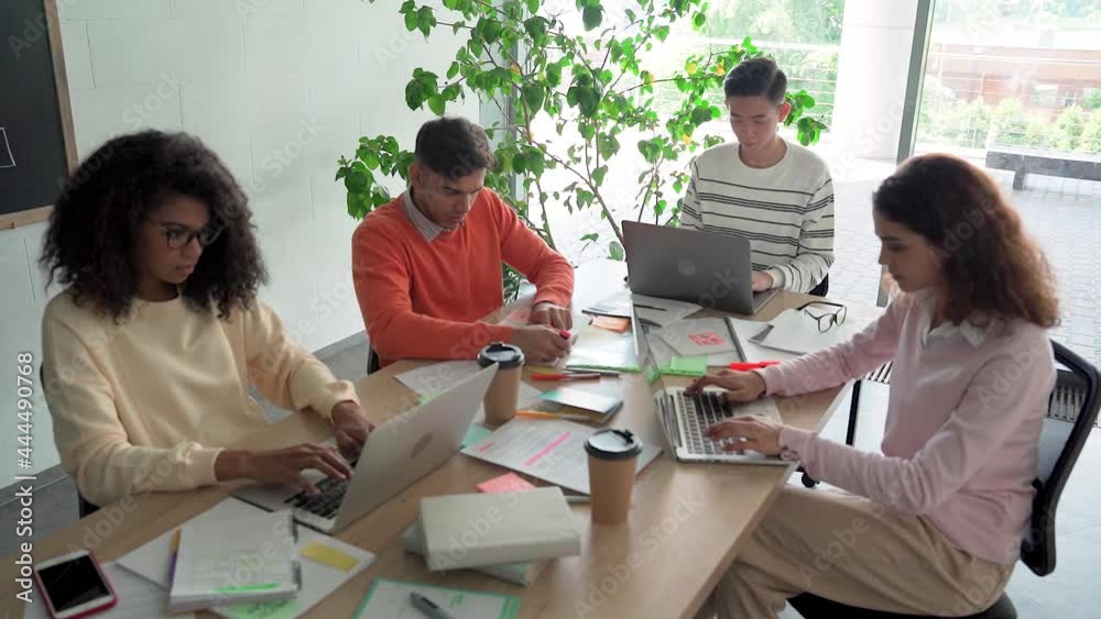 Young happy laughing creative team four multicultural coworkers ...