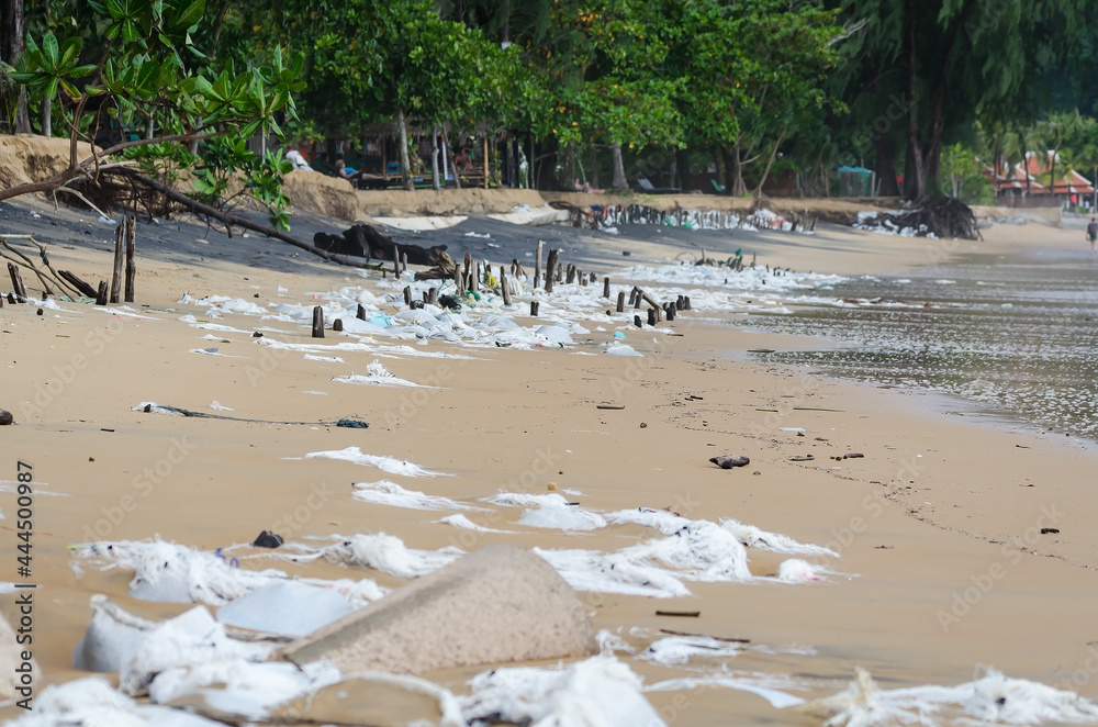 garbage on the baech Beach pollution. Plastic bottles and other trash ...