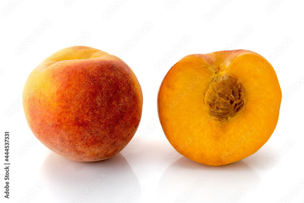 Italian Percoca peach variety with yellow flesh, one whole and another ...