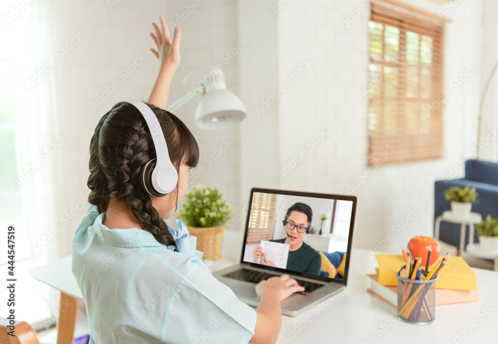 Homeschool Asian little young girl student learning virtual internet ...