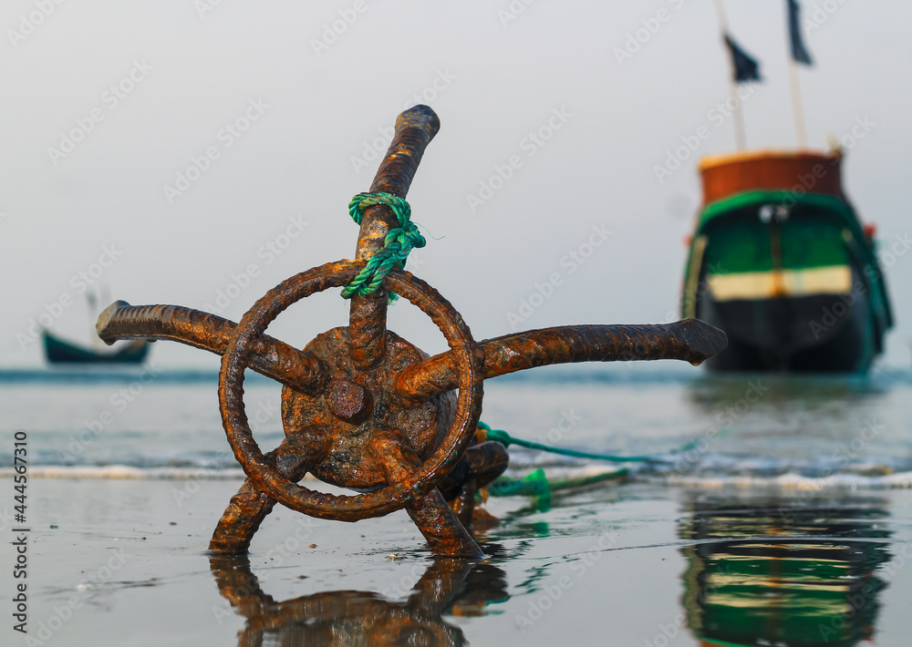A fishing boat anchored by the beach in St. Martin's Island, Bangladesh ...
