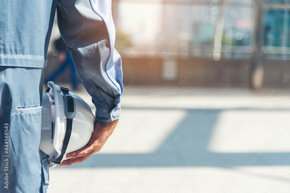 Engineer man hands holding hardhat white work helmet hard hat for ...