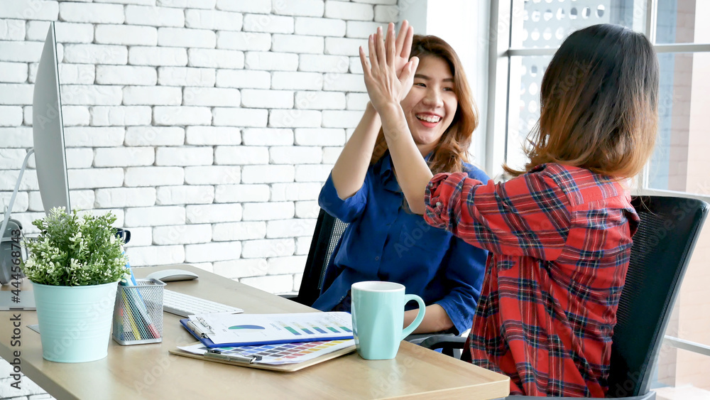 Asian colleague friendship at work with smiling face. Happiness two ...