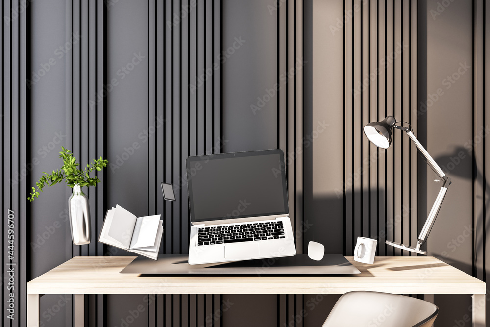Modern hipster office interior with empty black laptop screen and other ...