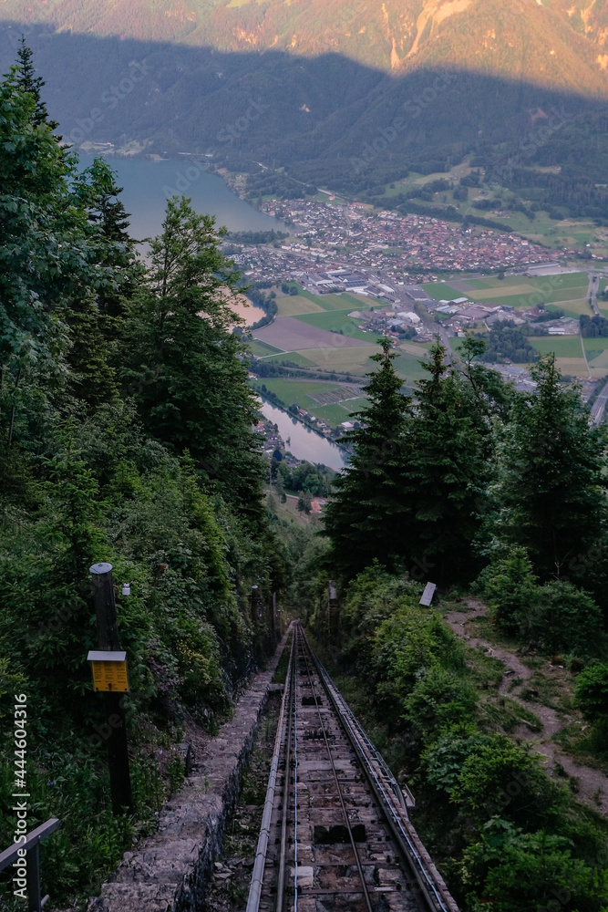 Red Funicular Train driving downhill from Harder Kulm, Top of ...