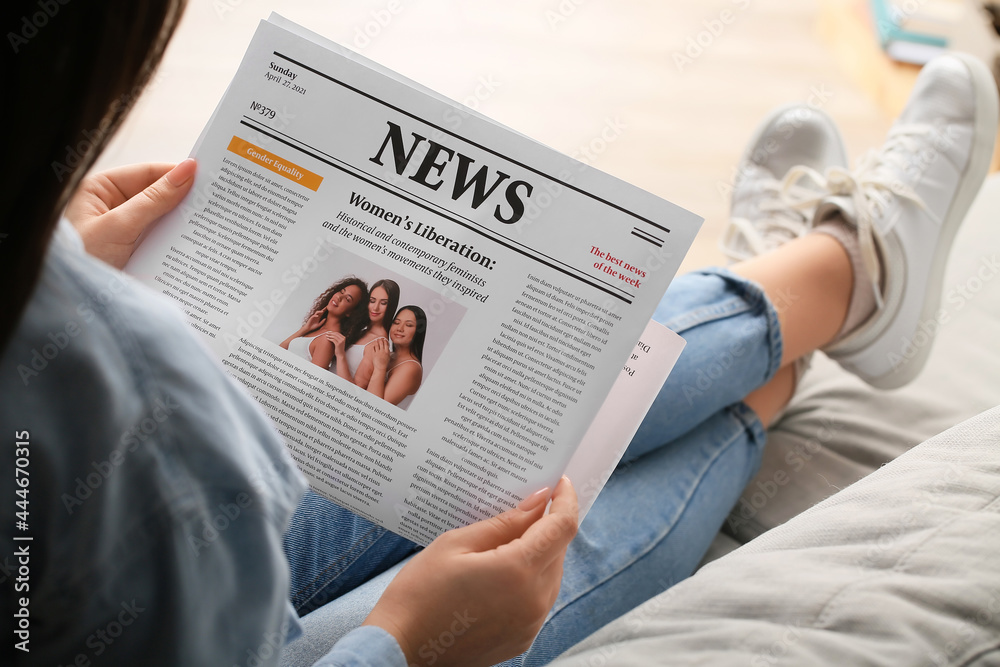 Someone Reading A Newspaper