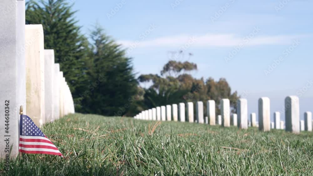 Tombstones and american flag, national memorial cemetery, military ...