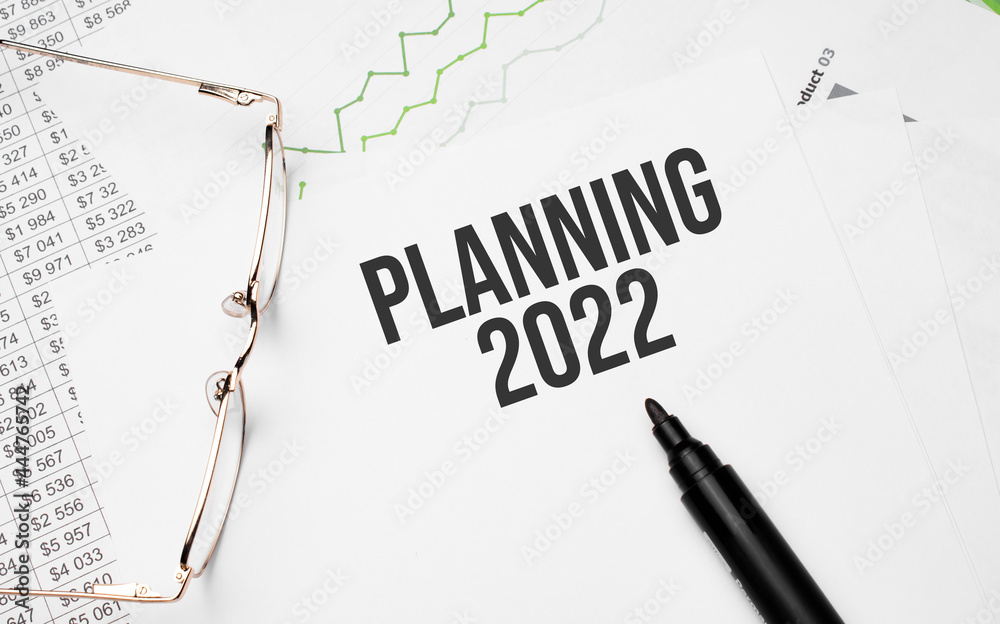 planning 2022. Conceptual background with chart ,papers, pen and ...