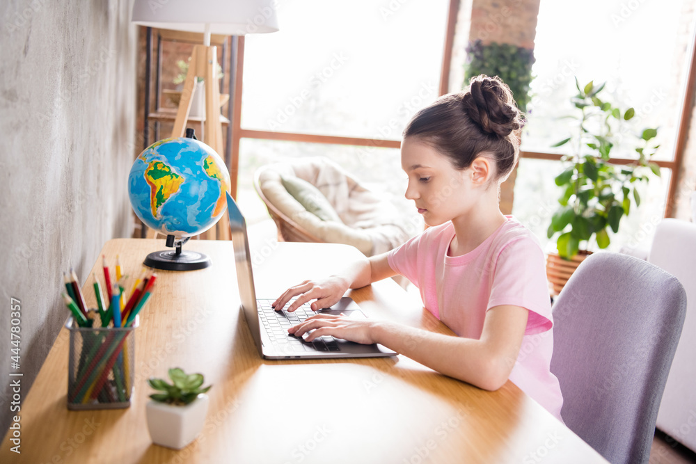 Profile side view portrait of attractive focused preteen girl studying ...