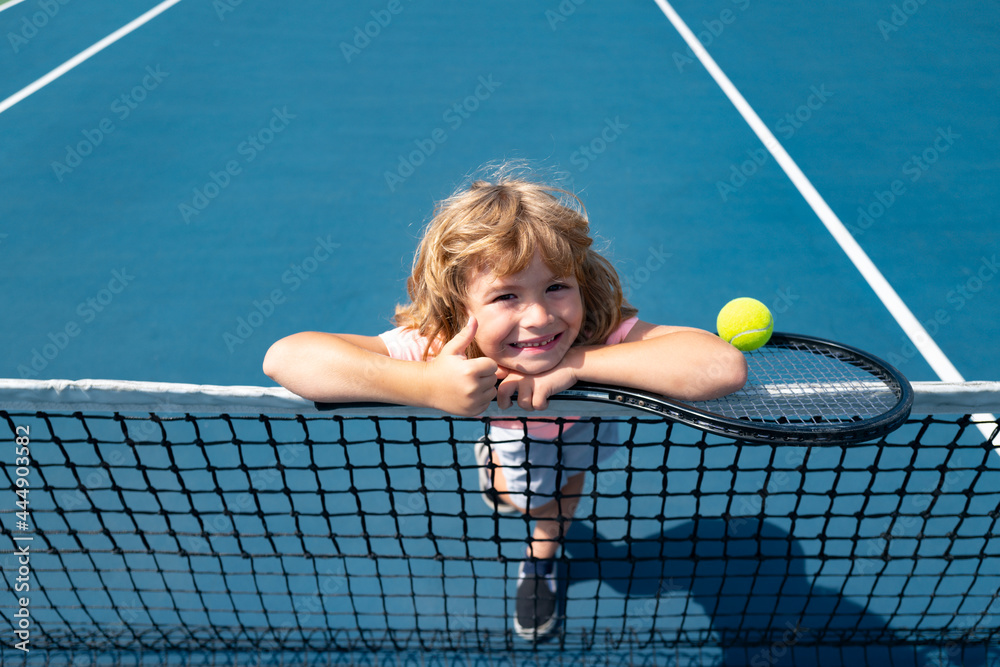 Little boy playing tennis. Sport kids, thumbs up, winner. Child with ...