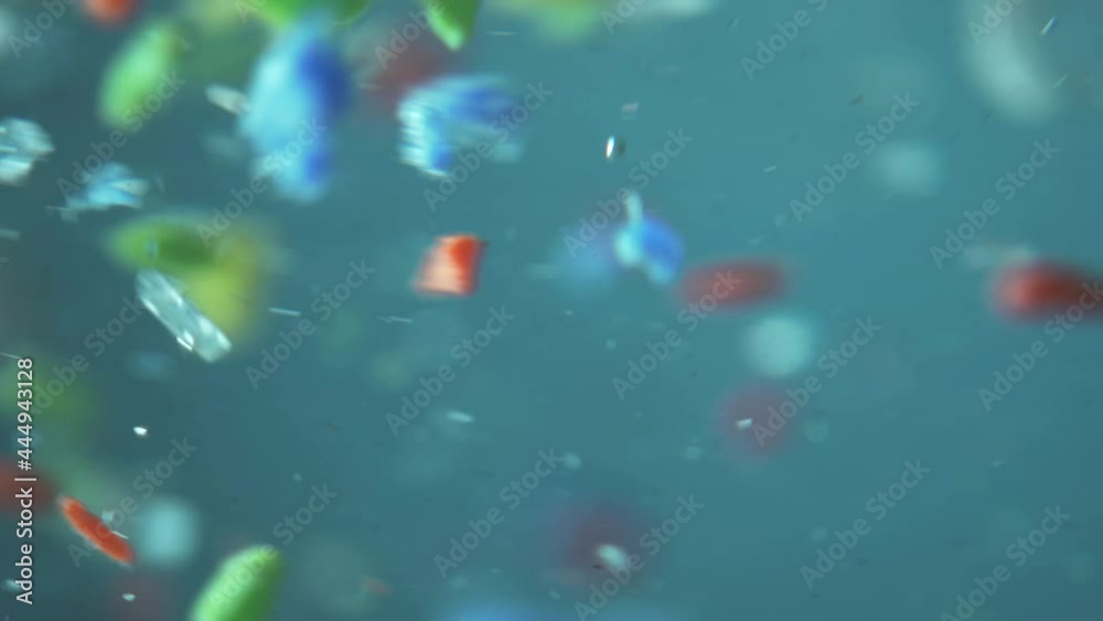 microplastics in water, tiny multicolored plastic bits. global ocean ...