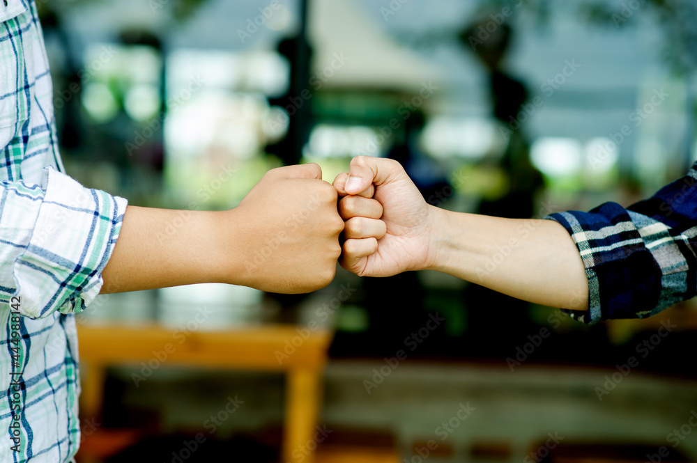 Two fists teamwork unity Close-up of two hands showing fist bumps as ...