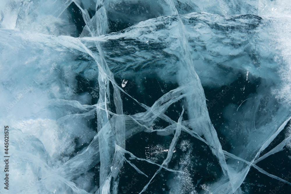 thin cracks of ice in a transparent lake Stock Photo | Adobe Stock