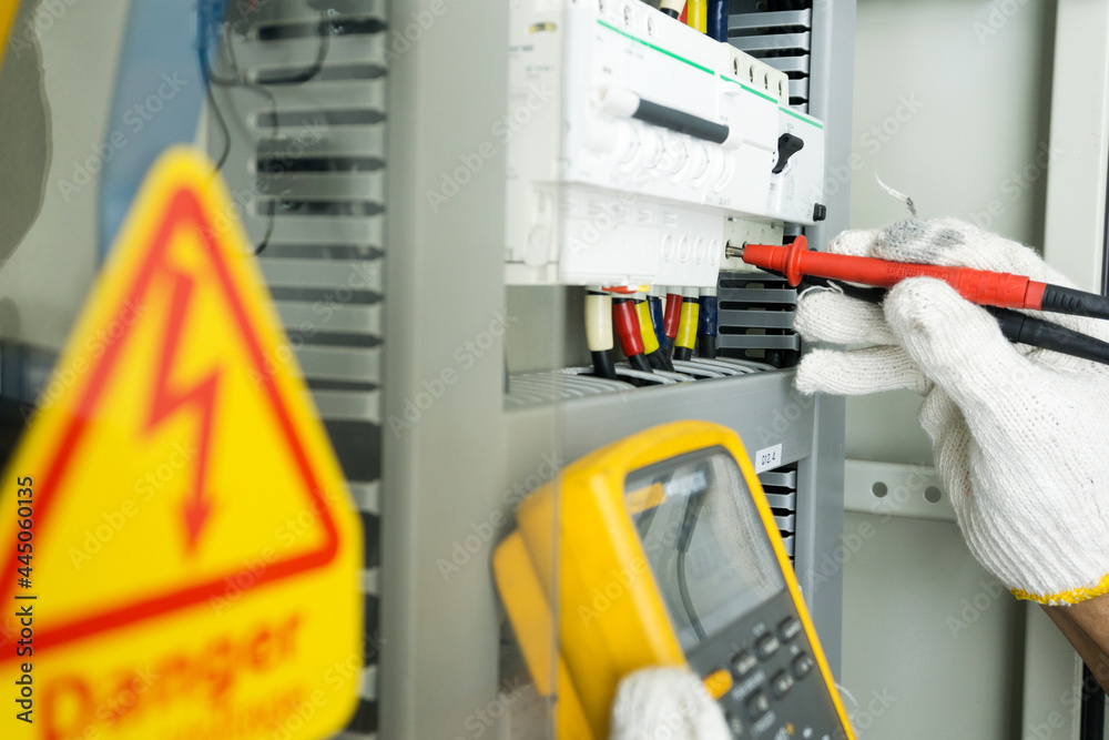 Electrician measurements with multimeter testing electrical ...