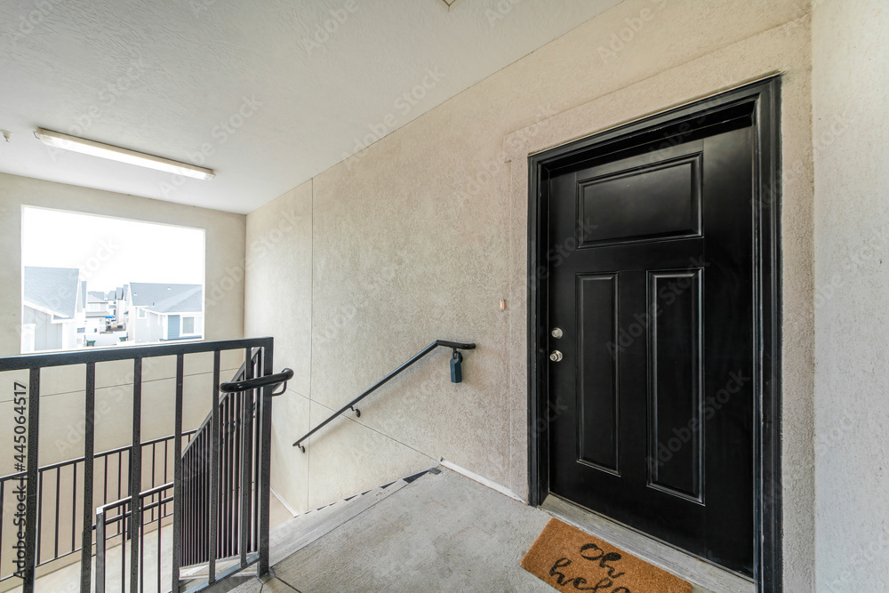 House interior upstairs with metal railings and wall mounted handrail ...