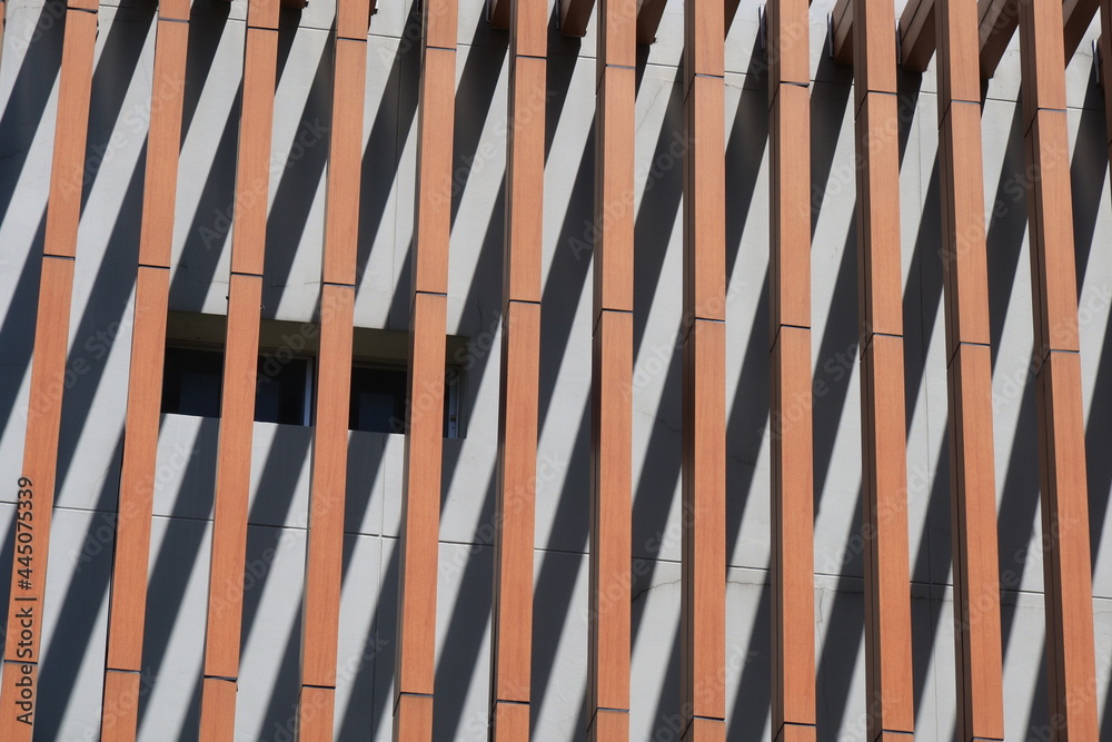 Sunlit outdoor vertical wood slats Stock Photo | Adobe Stock