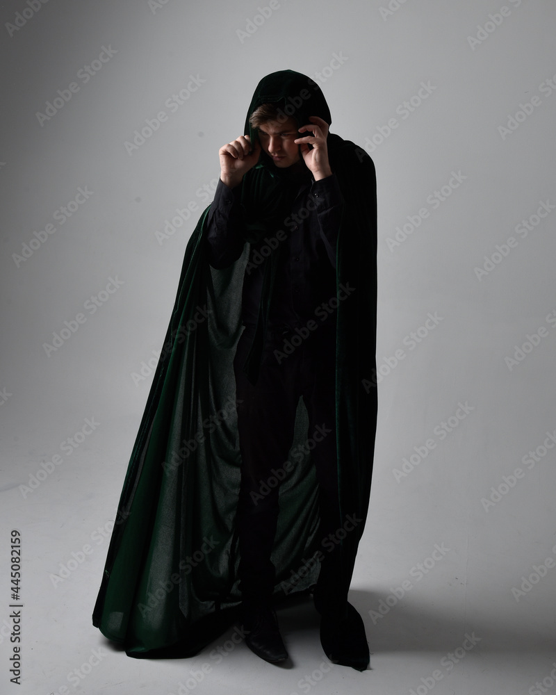 Full length portrait of a brunette man wearing black shirt, waistcoat ...