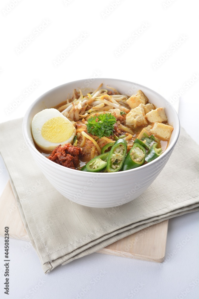 Malay mee rebus noodle with boiled egg, tofu, green chilli, sambal ...