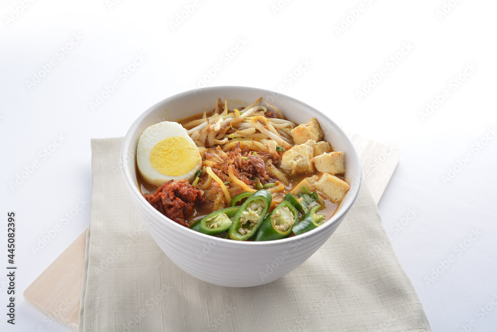 Malay mee rebus noodle with boiled egg, tofu, green chilli, sambal ...