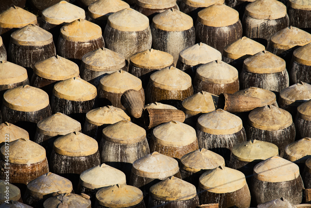 Huge jars filled with fermenting fish at a fish sauce factory in Xiapu ...