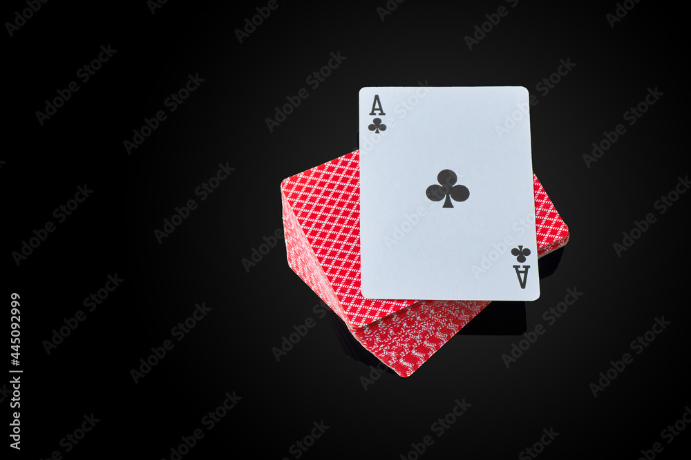 Full deck of playing cards with ace on top on dark reflective ...