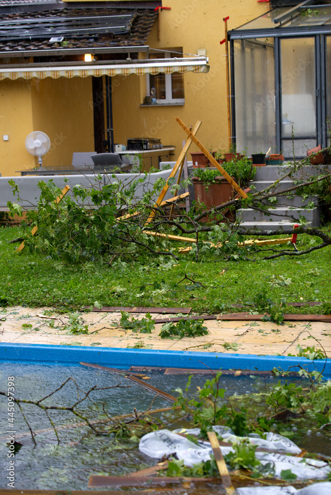 Private swimming pool covered with planks and branches after nighty ...