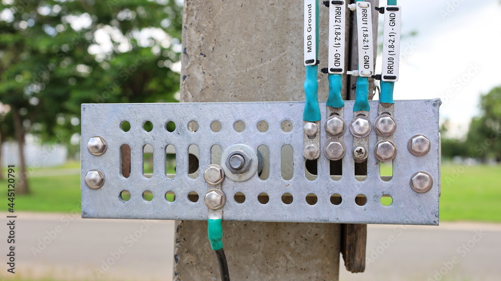 Ground bar with cable on pole. The lightning protection grounding ...