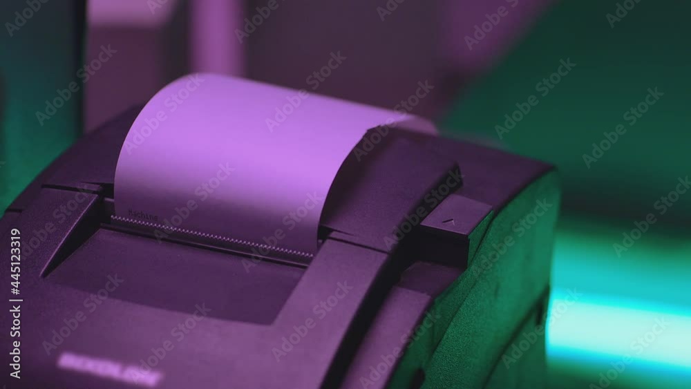 List of paper receipt with numbers getting out from the modern cash ...