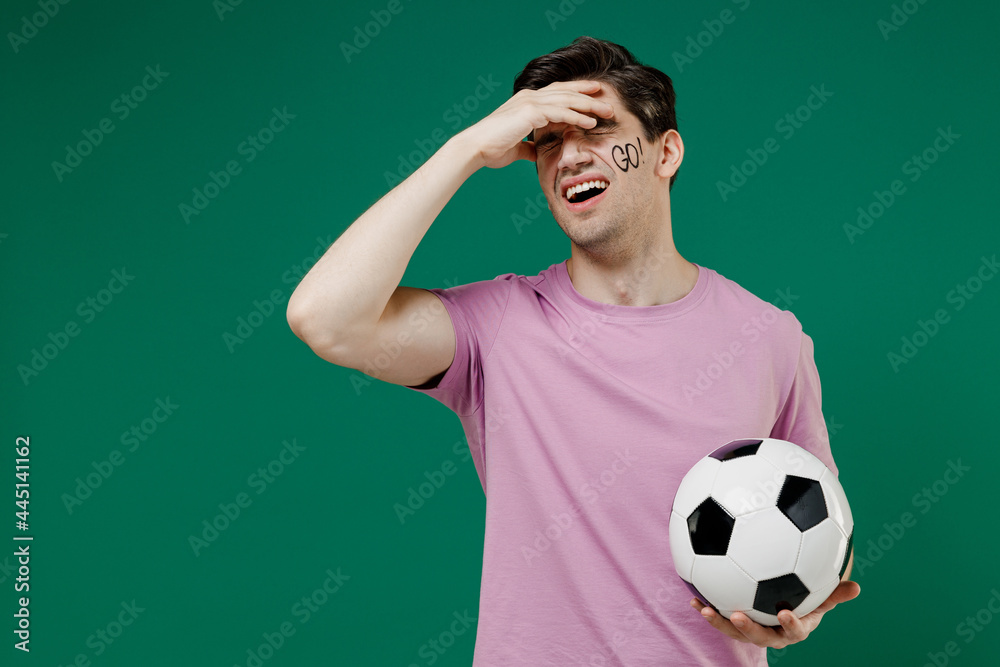 Young fun european man fan supporter wears basic pink t-shirt cheer up ...