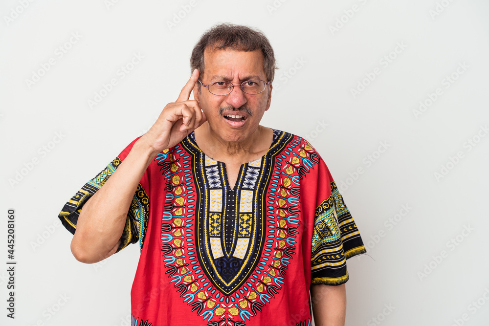 Senior indian man wearing a Indian costume isolated on white background ...