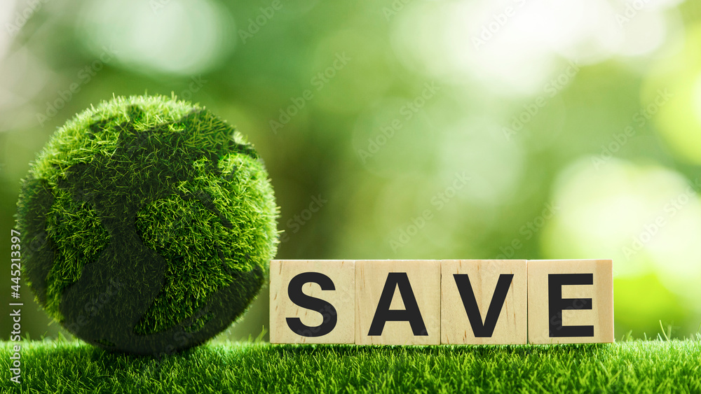 The word save is written on wooden blocks front globe and green ...