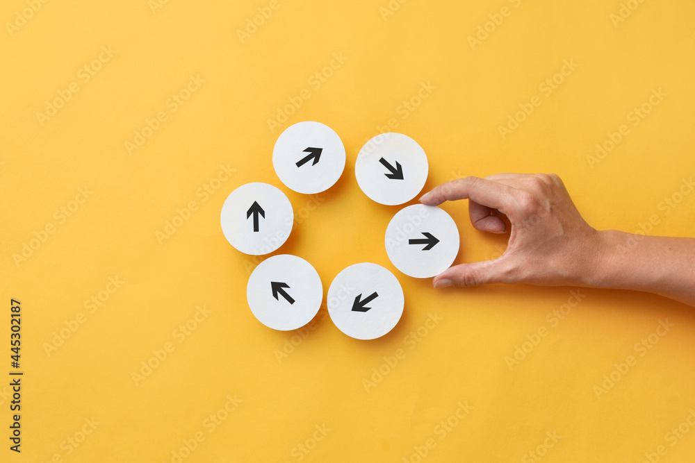 Many white arrows are moving in a circle, and one is outside the circle ...