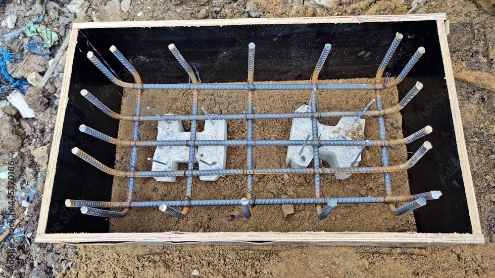 Steel grid square or iron wire column footing in shutter boards waiting ...