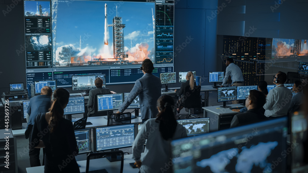 Foto de Group of People in Mission Control Center Witness Successful ...