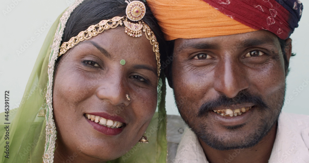 Indian couple with traditional attire smiling on white background Stock ...