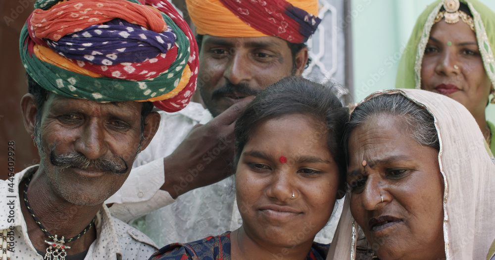 Group of South Asian people in traditional Indian clothing taking a ...
