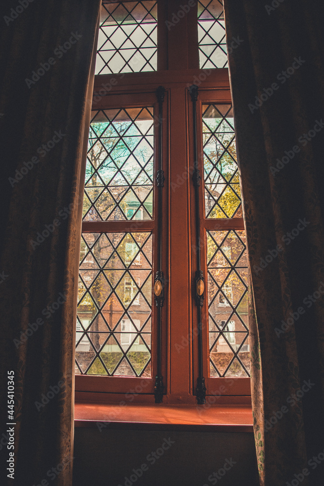 Grated window with curtains Stock Photo | Adobe Stock