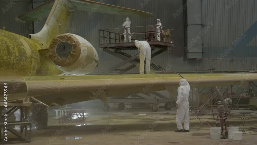 Preparing the aircraft for painting. General plan of the hangar with ...