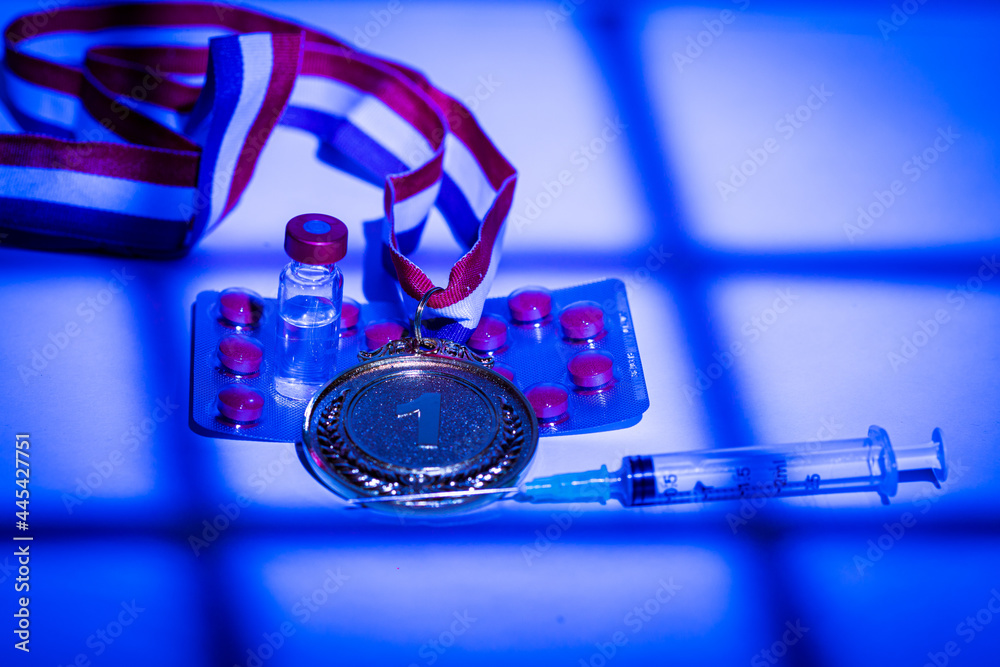 Champion gold medal, syringe with doping substance, pill tablet and ...