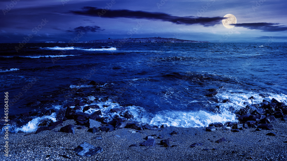 seascape at night. wonderful scenery with islands in full moon light ...