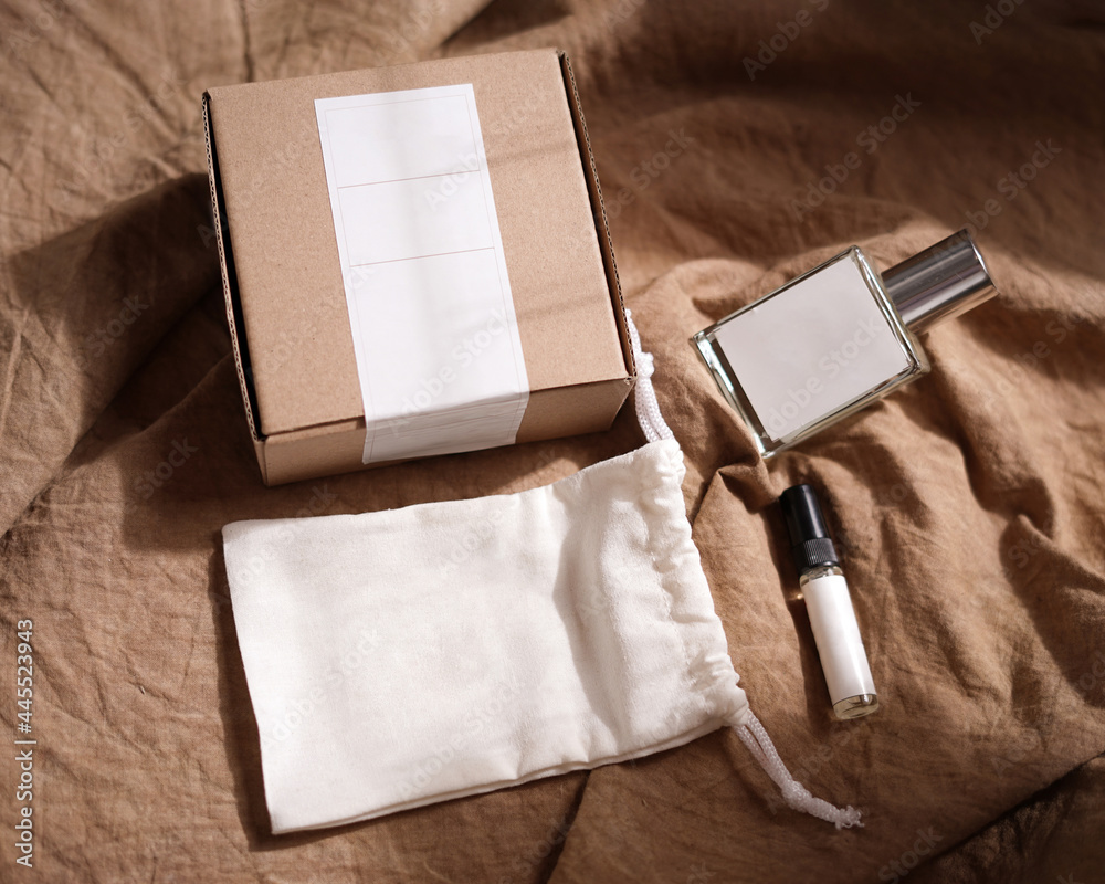 Empty bottles of various shapes and sizes isolated on a patterned brown ...