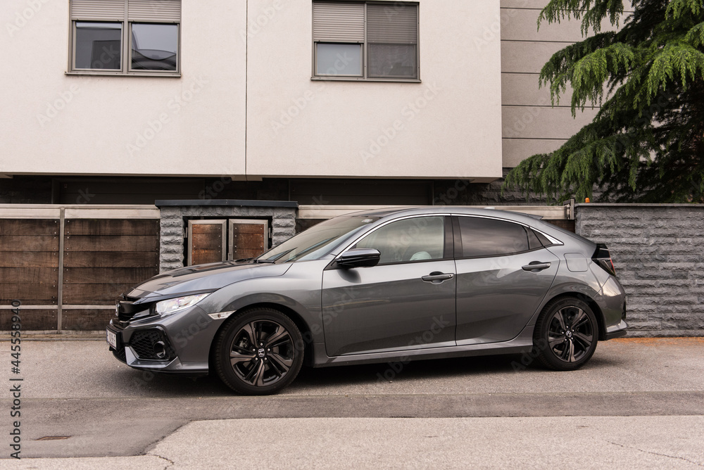 New Honda Civic in grey colour. New Honda design in urban environment ...