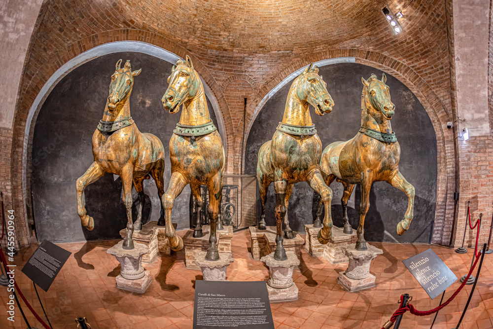 Ancient bronze horses inside the Basilica di San Marco in Venice. Famous quadriga from ...