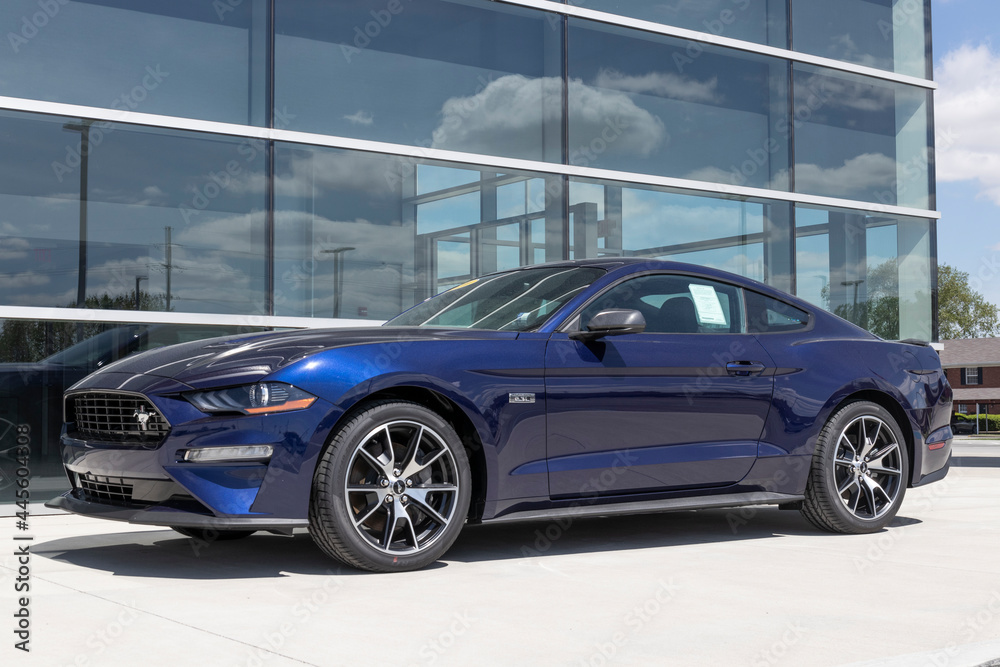 Ford Mustang display at a dealership. Ford offers the Mustang in a base ...
