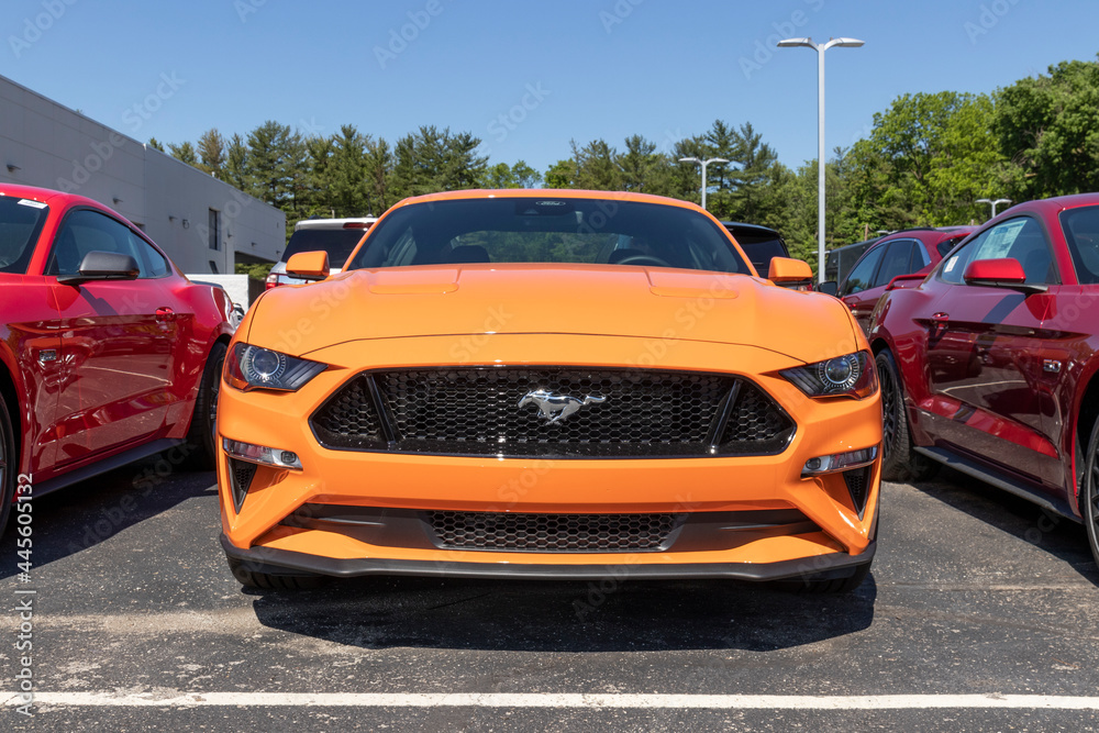 Ford Mustang display at a dealership. Ford offers the Mustang in a base ...