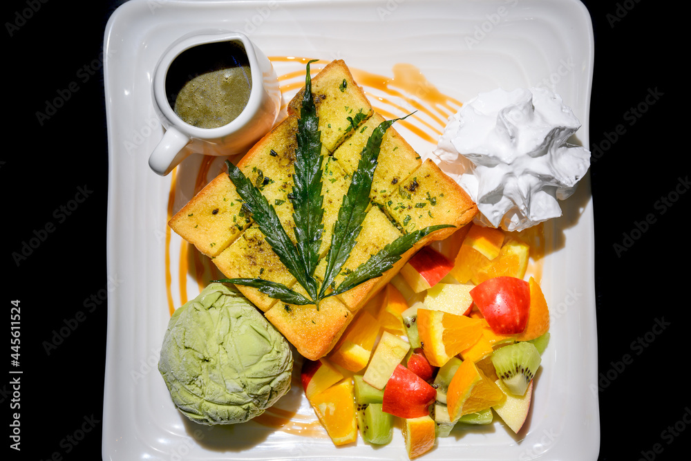 Image of cannabis honey toast and mixed fruits in a white plate with ...