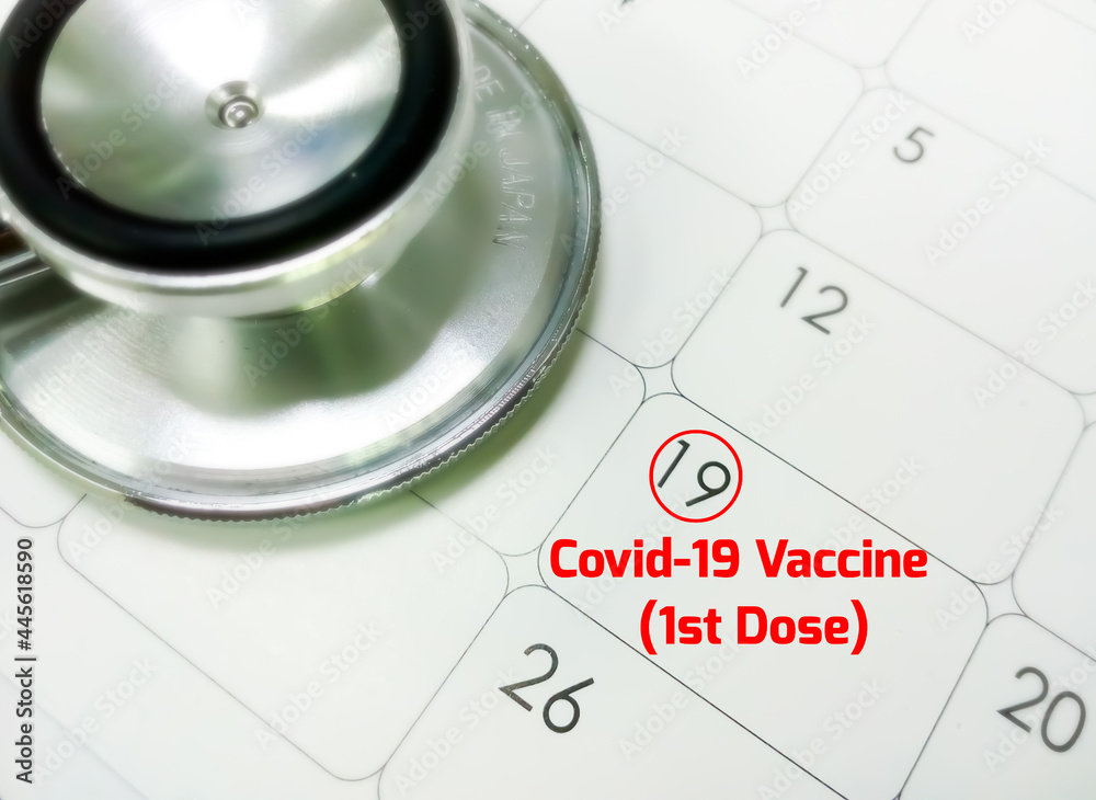 Covid-19 coronavirus vaccine (1st dose) reminder on calendar with ...