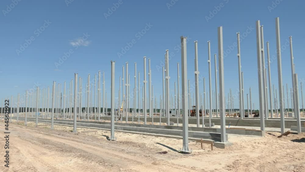 metal support poles in an industrial building warehouse. Construction ...